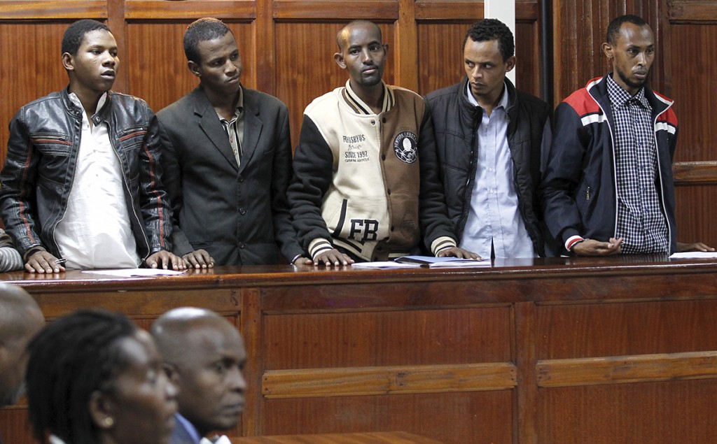 Suspects stands inside the dock at the Milimani Law Courts in Kenya's ...